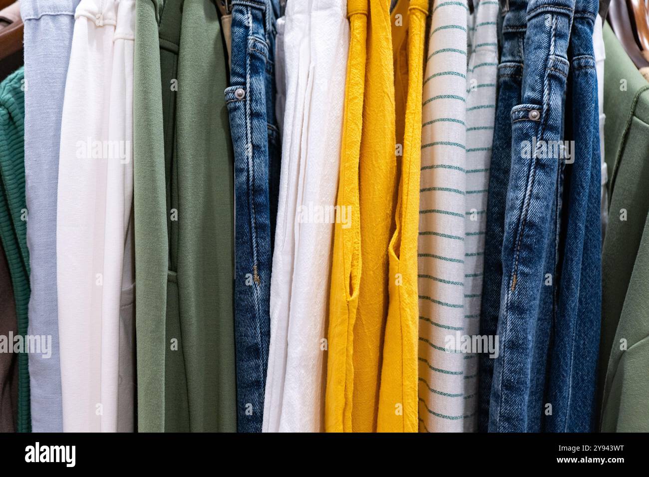 A detailed view of a selection of colorful garments neatly arranged and ...