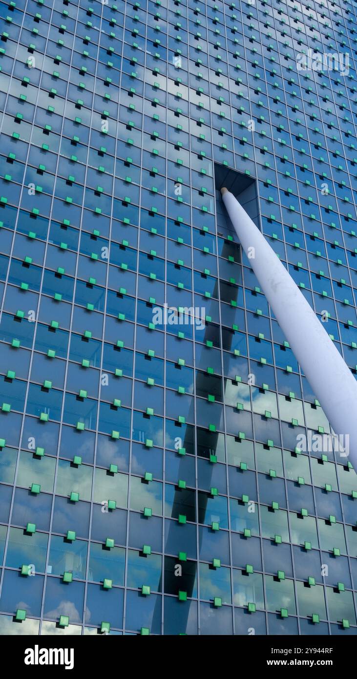 A striking image showcasing modern architecture, featuring a tall white ...