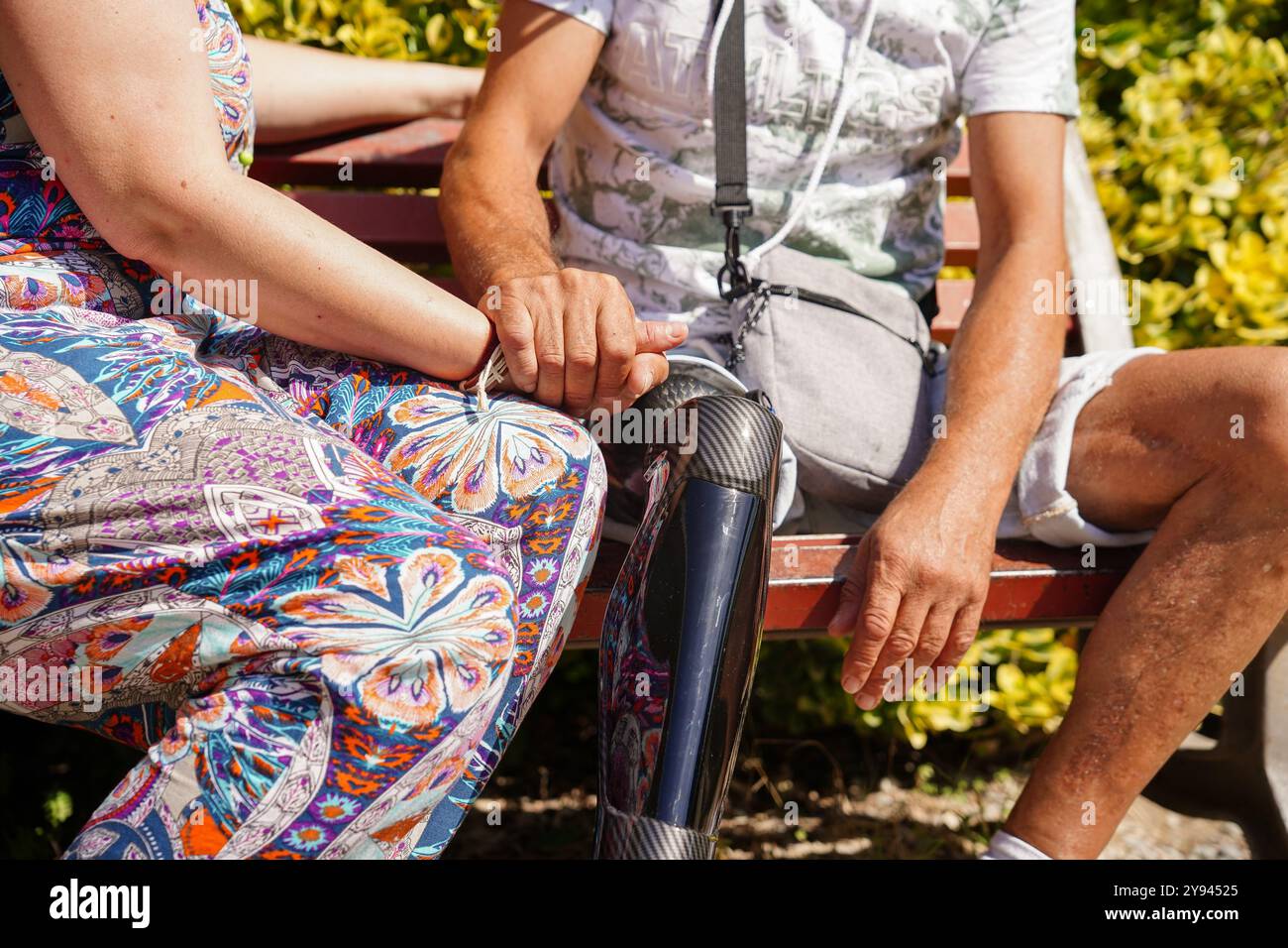 A warm, sunny day backdrop frames a touching scene of a man with a ...