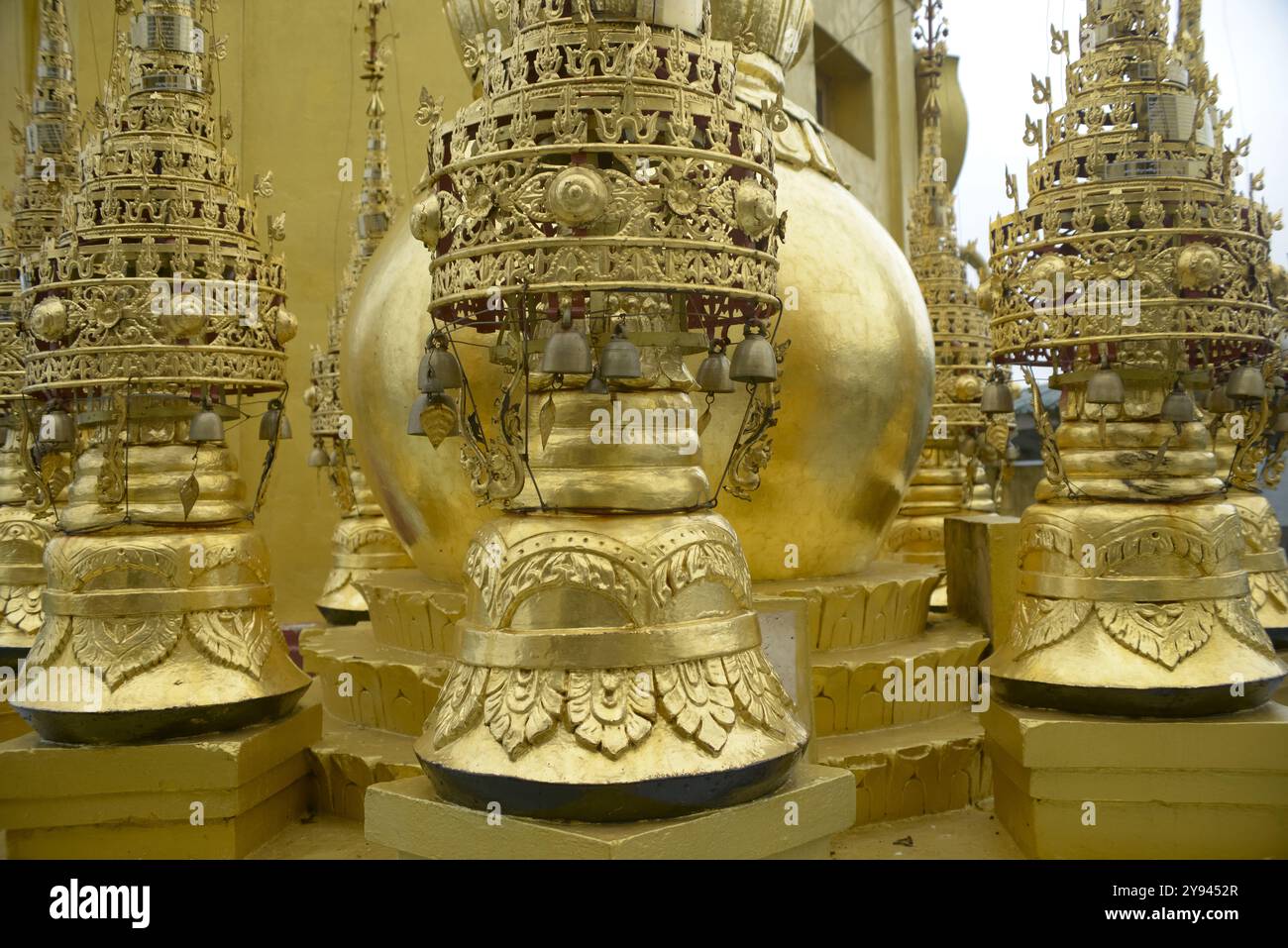 Intricate golden hti (umbrella-like structures) adorn the stupas at ...