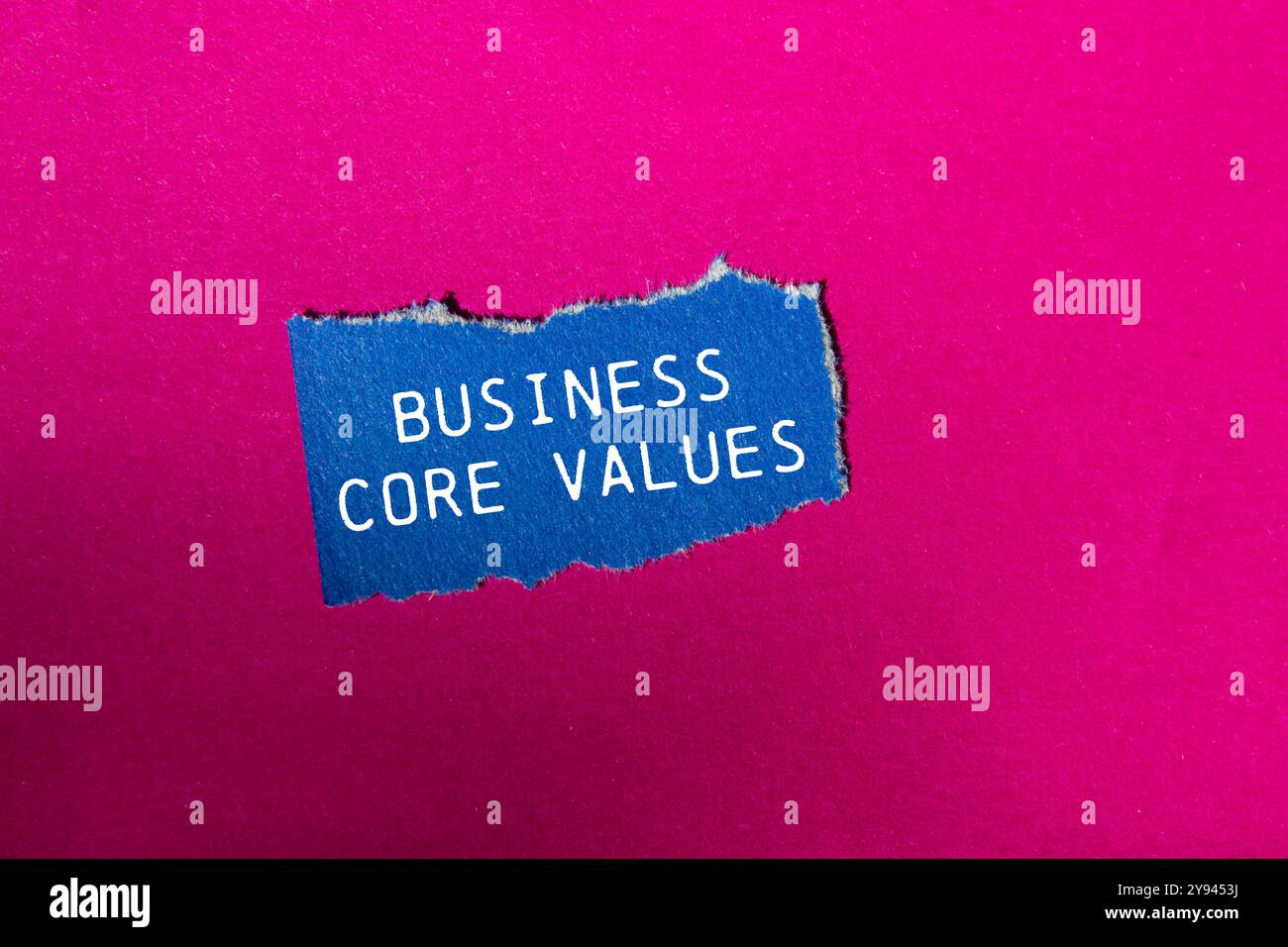 Business core values message written on ripped blue torn paper piece on ...