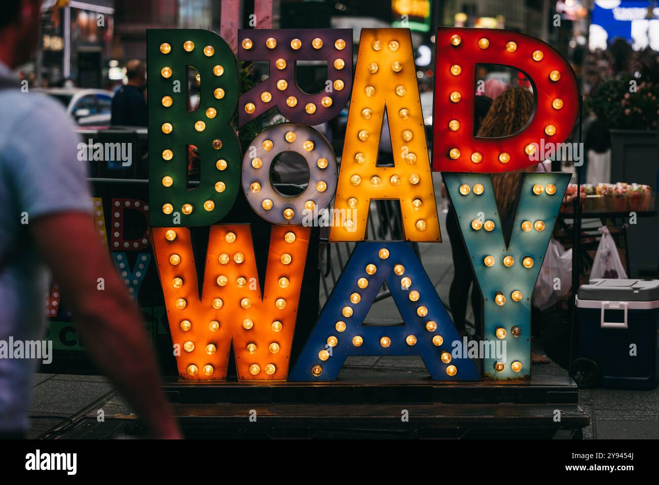 A vibrant, illuminated Broadway sign in Times Square, New York City ...
