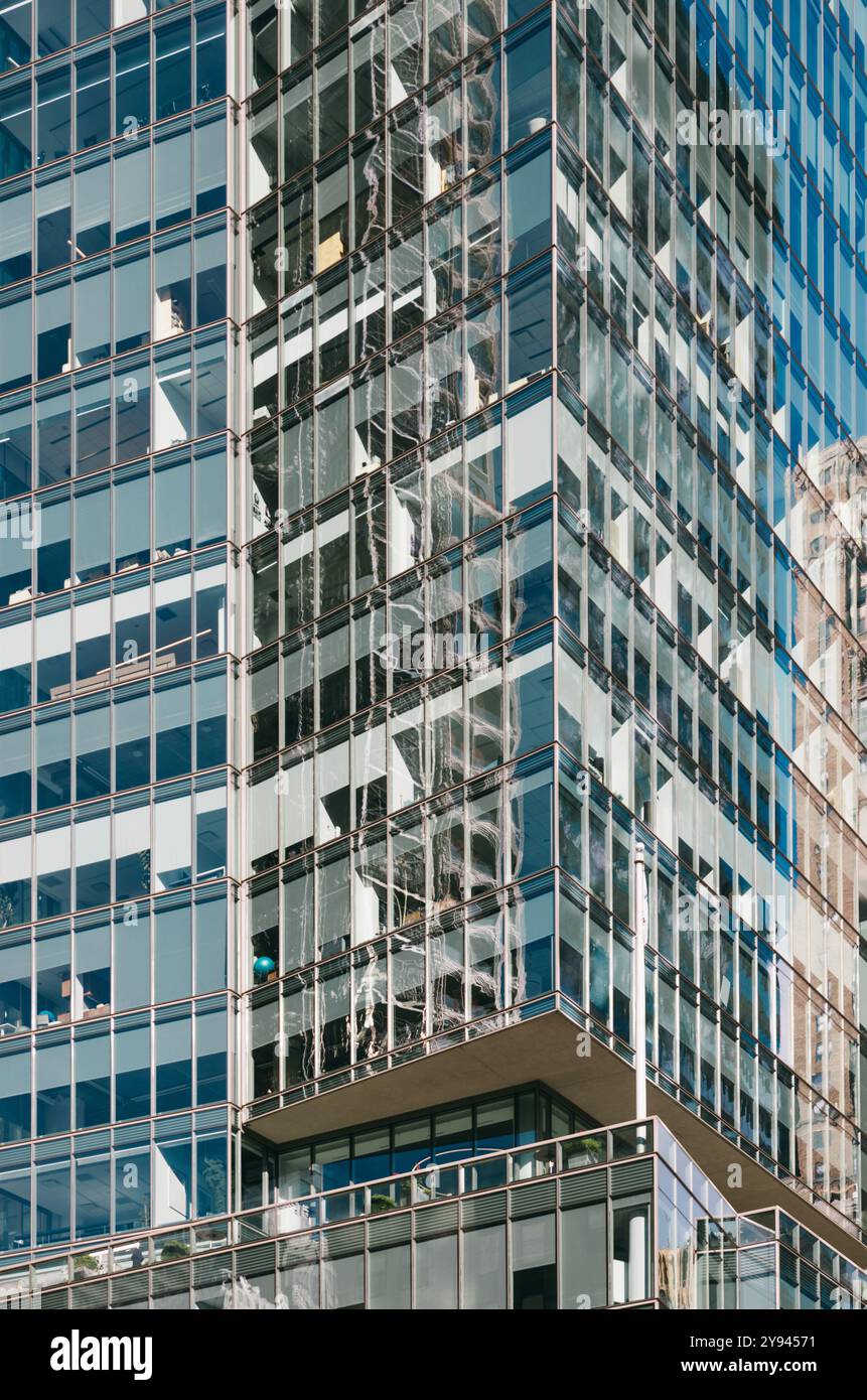 Close-up of a modern glass office building in New York City displaying ...