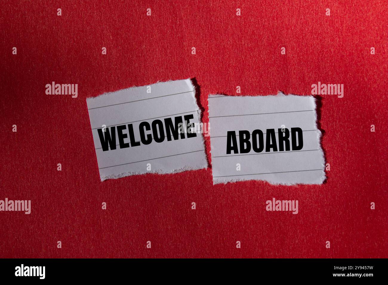 Welcome aboard message written on ripped torn paper piece with red ...