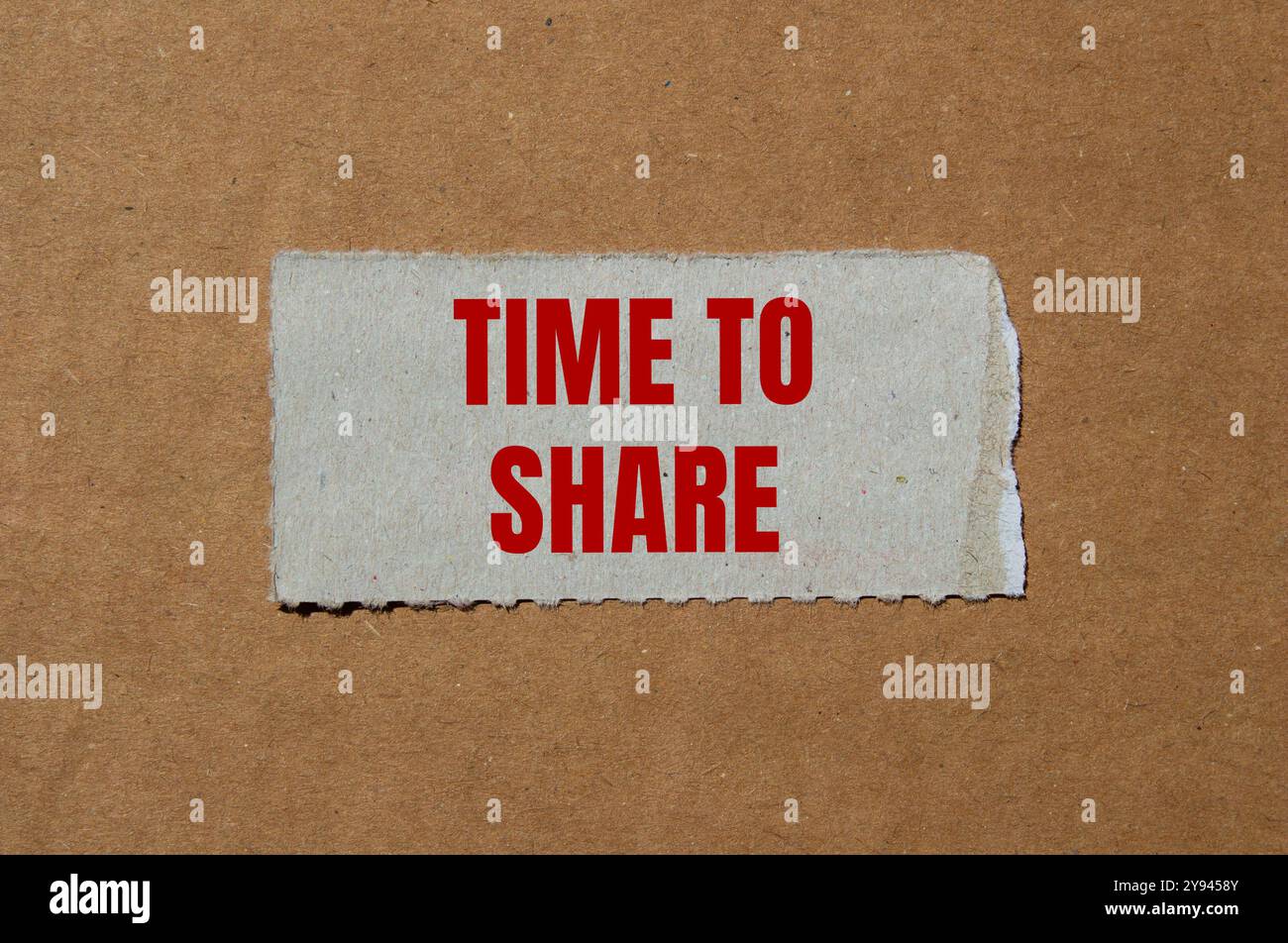 Time to share message written on ripped torn paper piece with cardboard ...