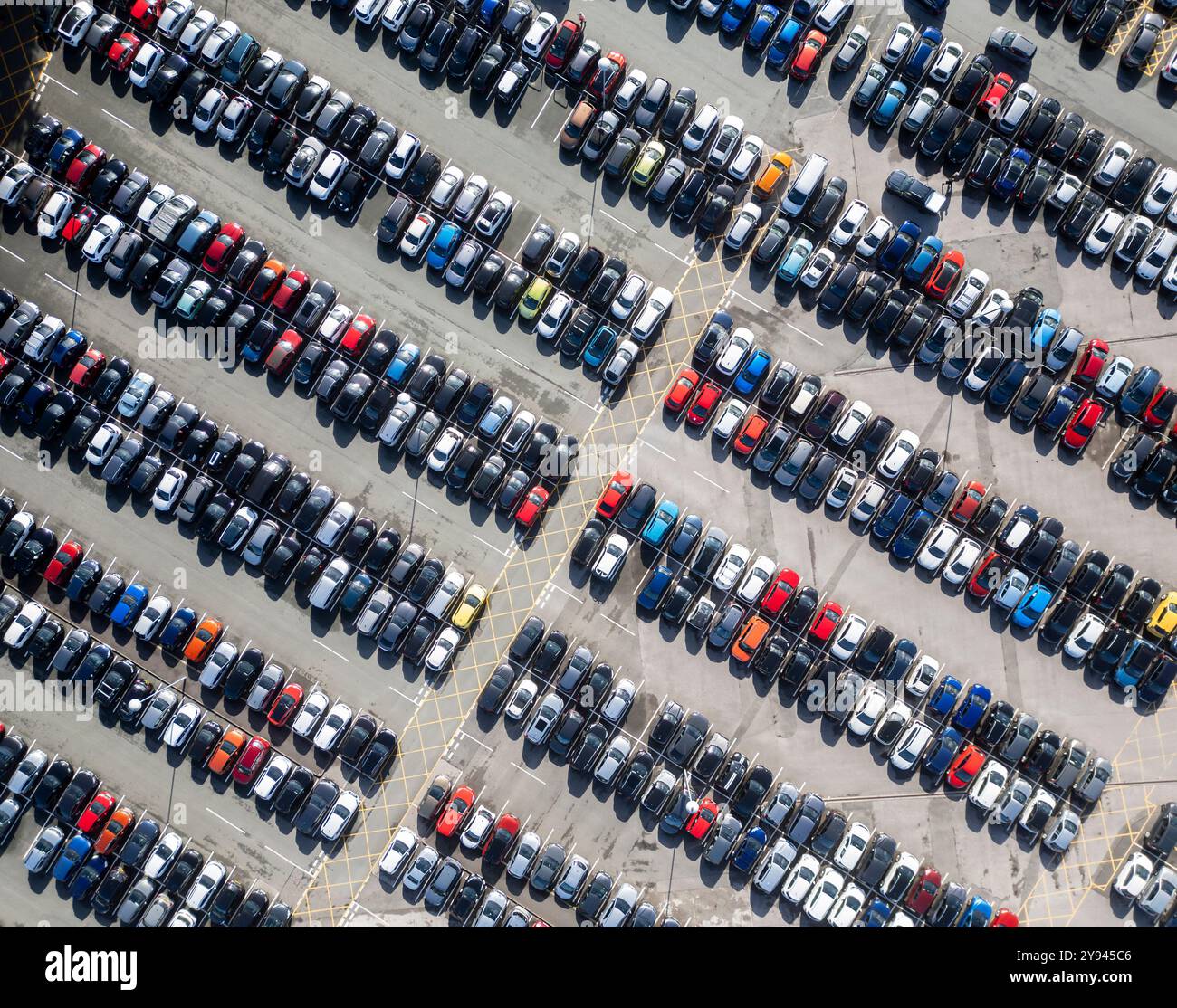Top down aerial view of rows of parked cars in a car park, England ...