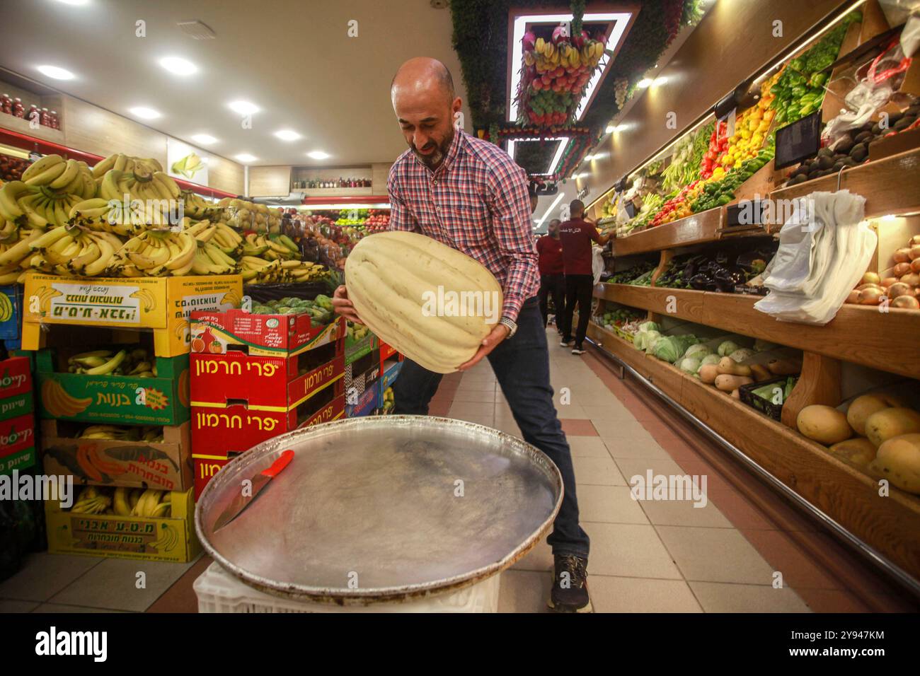 Nablus, Palestine. 08th Oct, 2024. Palestinian Amir Shana holds a ...