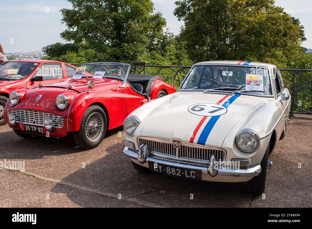 Suresnes, France 09.21.2024. A 1967 MG car and a Triumph TR3 car at a ...