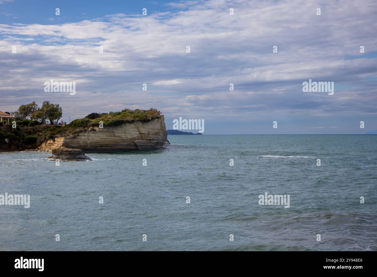 Sandstone cliffs, covered by fresh greenery, creating a bay Canal d ...