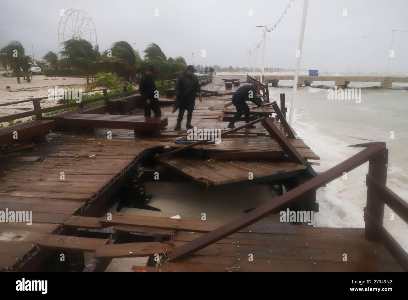 Yucatan State police inspect damage at the harbor from Hurricane Milton ...