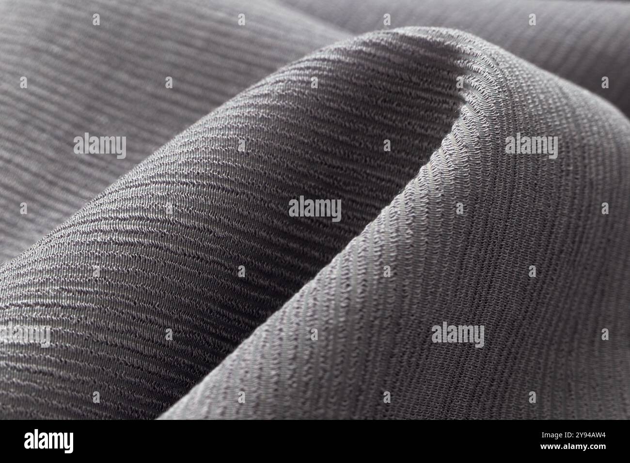 Close-up of textured gray fabric with fine ribbed pattern, elegant and ...