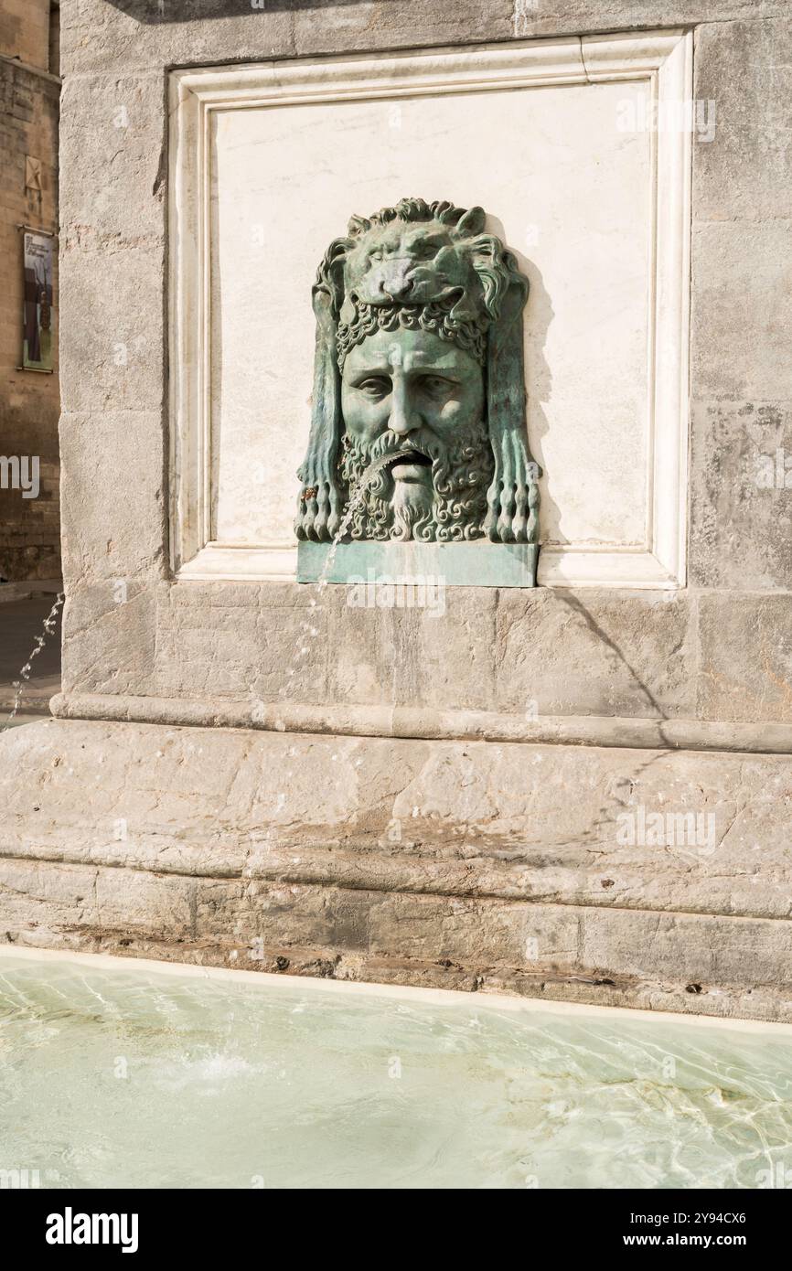 Water fountain at the base of the obelisk in the Place de la Republique ...