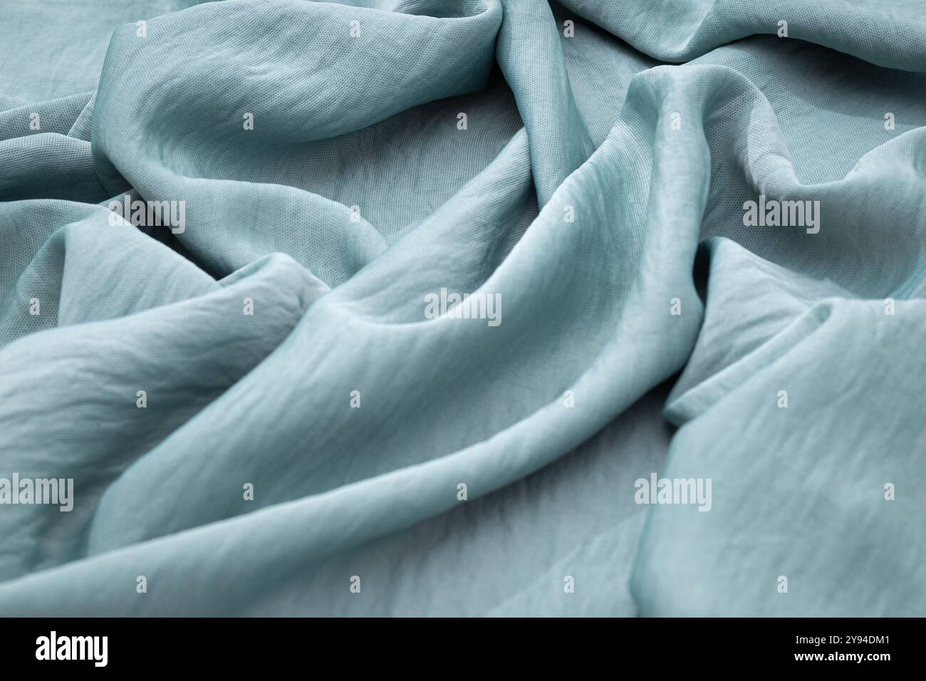Soft blue fabric with delicate folds and smooth texture, ideal for ...