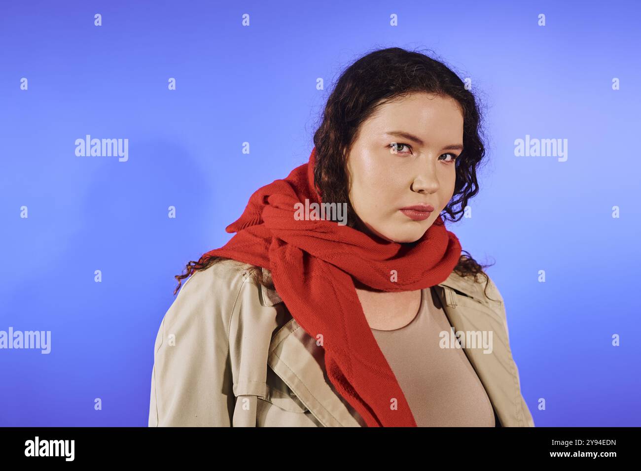 A confident plus size woman poses gracefully, showcasing her style with ...