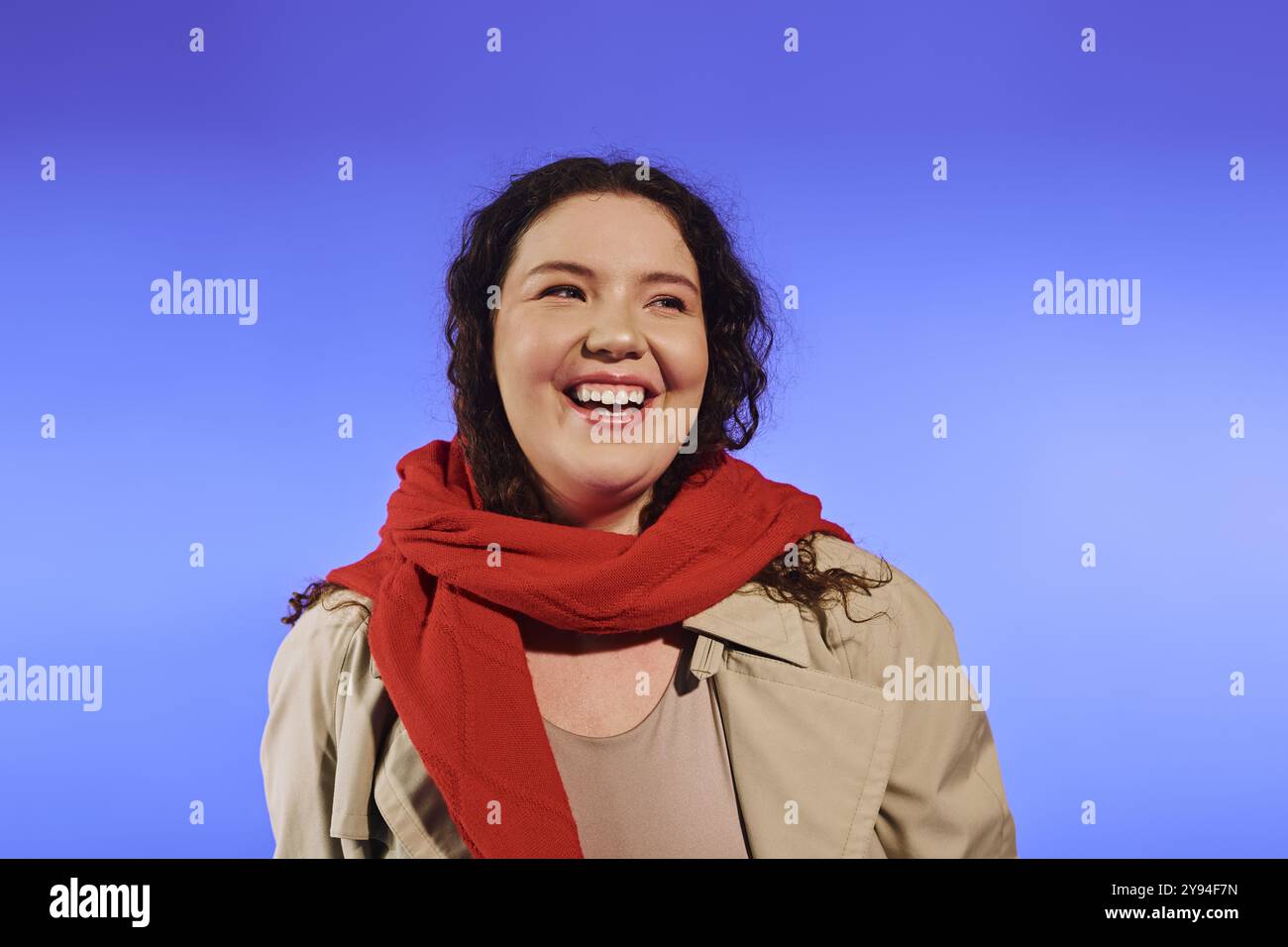 A beautiful plus size woman adorned in a stylish outfit, embracing the ...