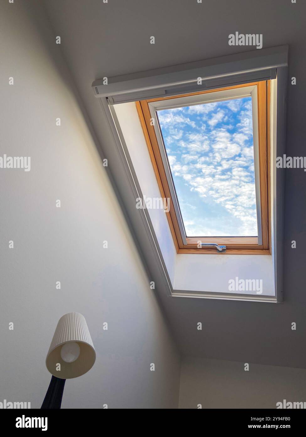 Clear sky view through a skylight reveals a vibrant array of clouds ...