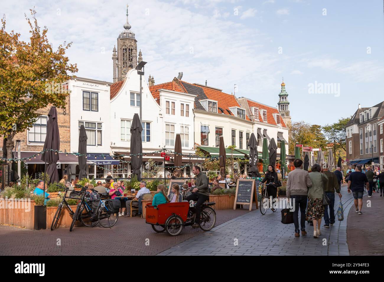 People walk and cycle in the pleasant center of Middelburg in the ...