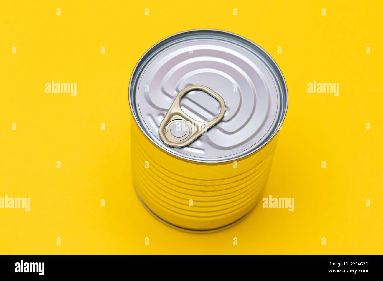 Unopened Tin Can with Blank Edge on Yellow Background. Canned Food ...