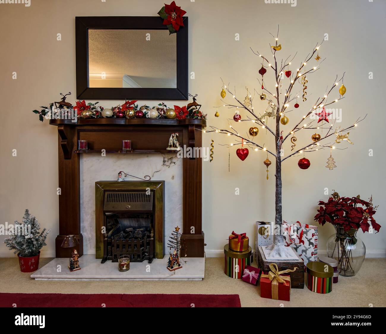 Modern Twig Style Christmas Tree decorated in traditional red and gold ...