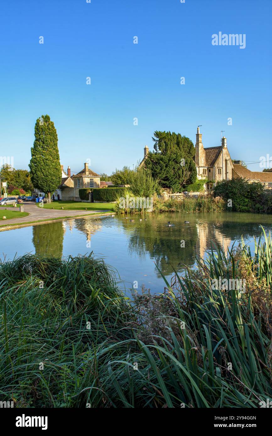 The picturesque village of Biddestone and duck pond in the Cotswolds ...