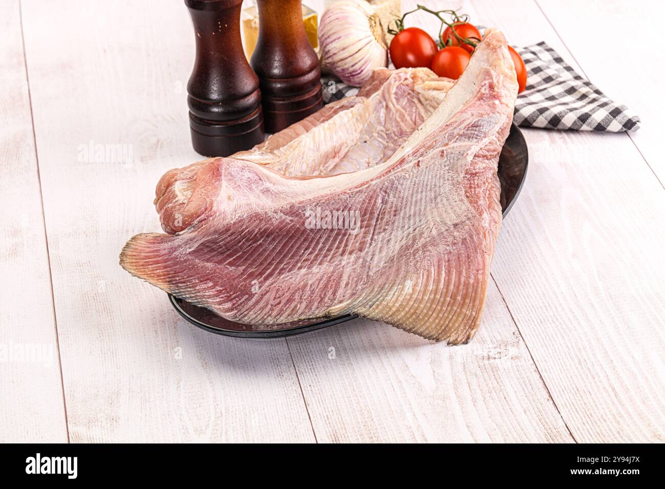 Raw uncooked stingray fish wing in thw plate Stock Photo - Alamy
