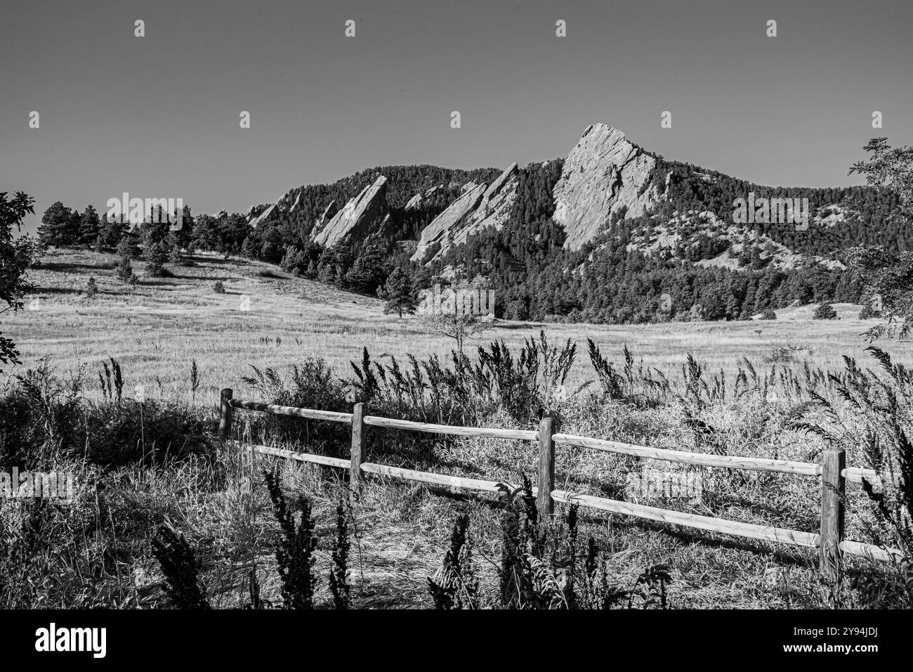 beautiful image of the Flatirons dark granite mountains from below with ...