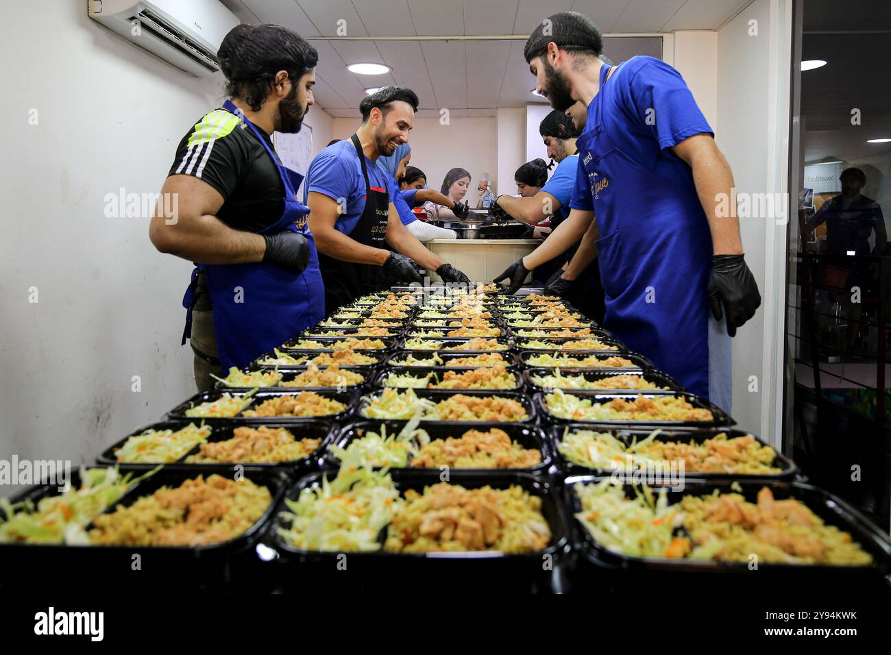 Beirut, Lebanon. 8th Oct, 2024. Volunteers from a Lebanese NGO food ...