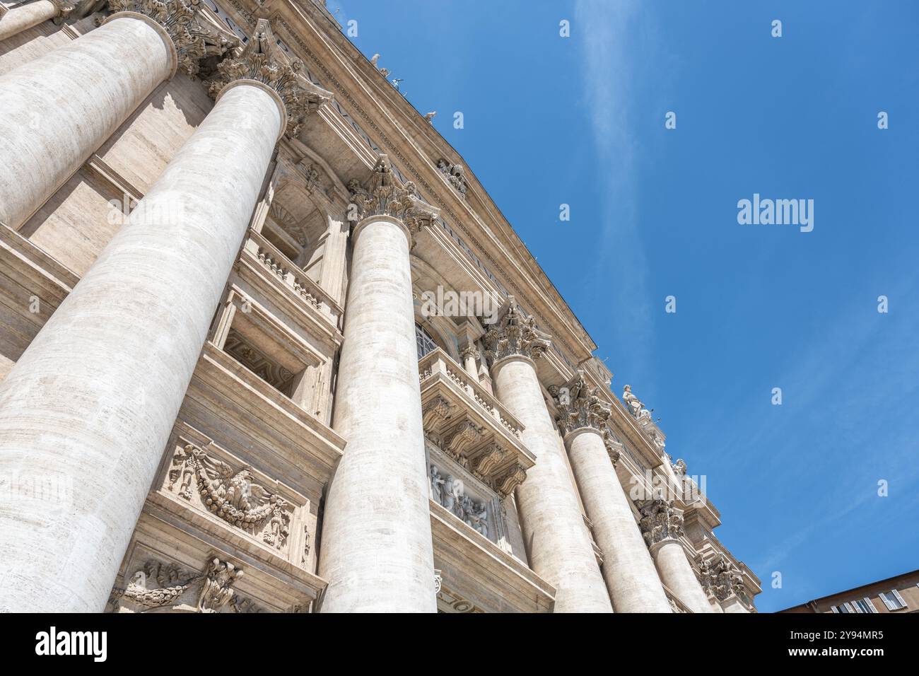 The majestic pillars of St. Peter's Basilica rise prominently ...