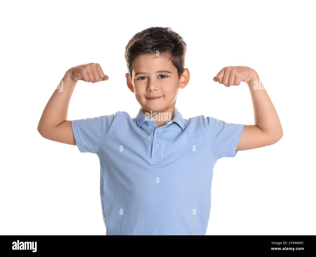 Cute little boy showing his biceps on white background Stock Photo - Alamy
