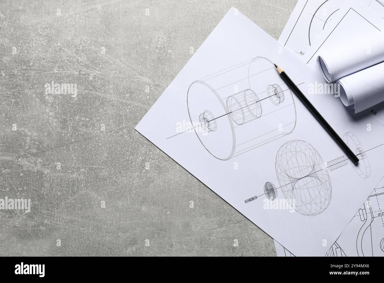 Different engineering drawings and pencil on gray textured table, top ...