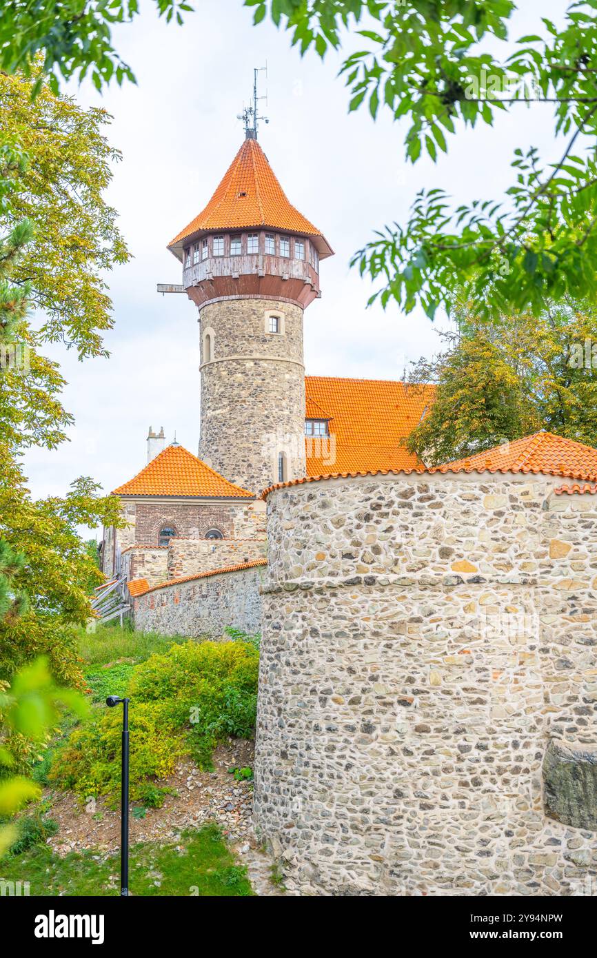 The striking lookout tower of Hnevin Castle rises above mossy walls ...