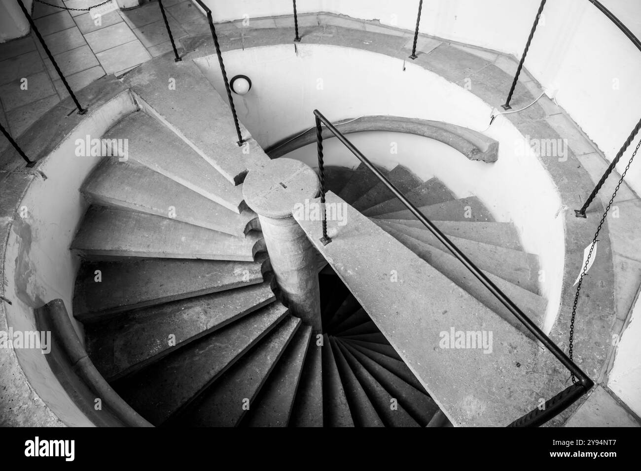 A unique double helix staircase spirals gracefully, showcasing its ...