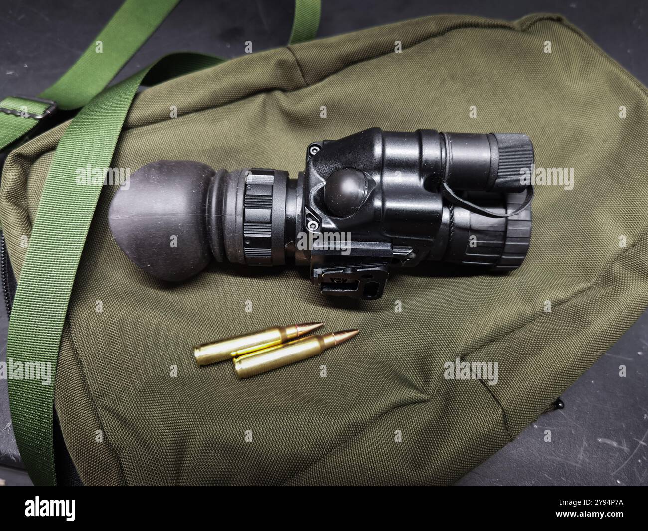 Night vision monocular and 5.56x45mm cartridges, close-up photo Stock ...