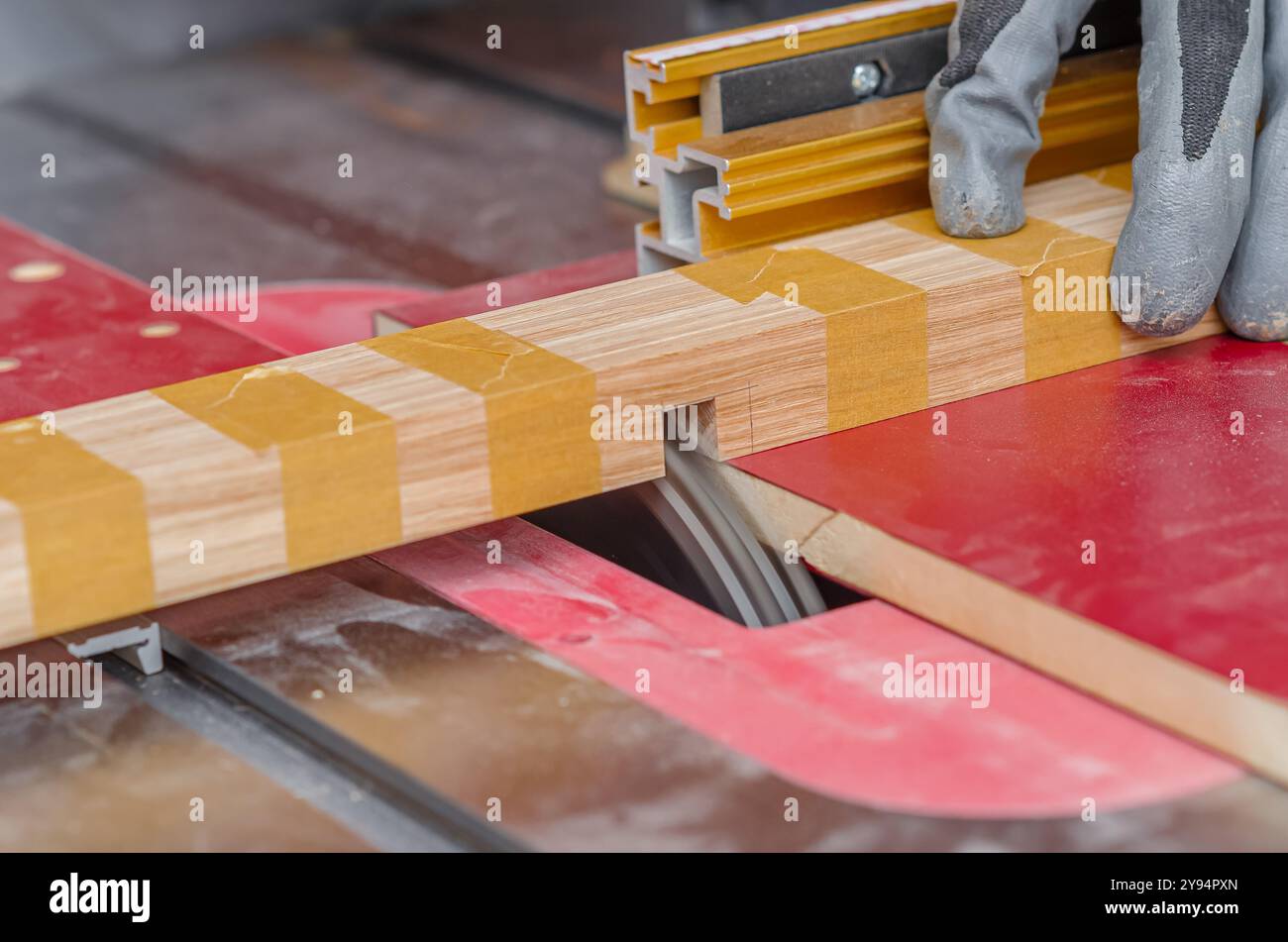 Circular saw cuts grooves in a board in a carpentry workshop Stock ...