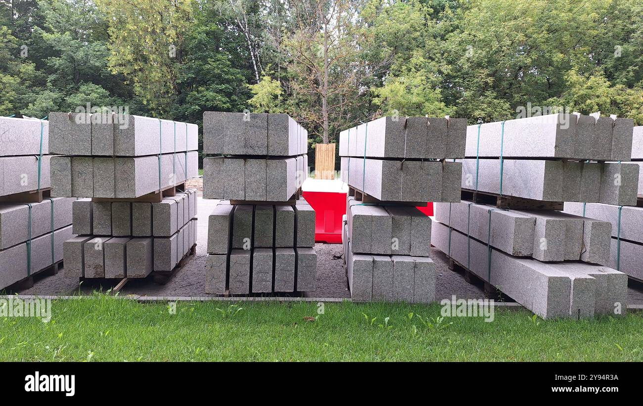 Concrete blocks stacked on pallets in outdoor storage area Stock Photo - Alamy