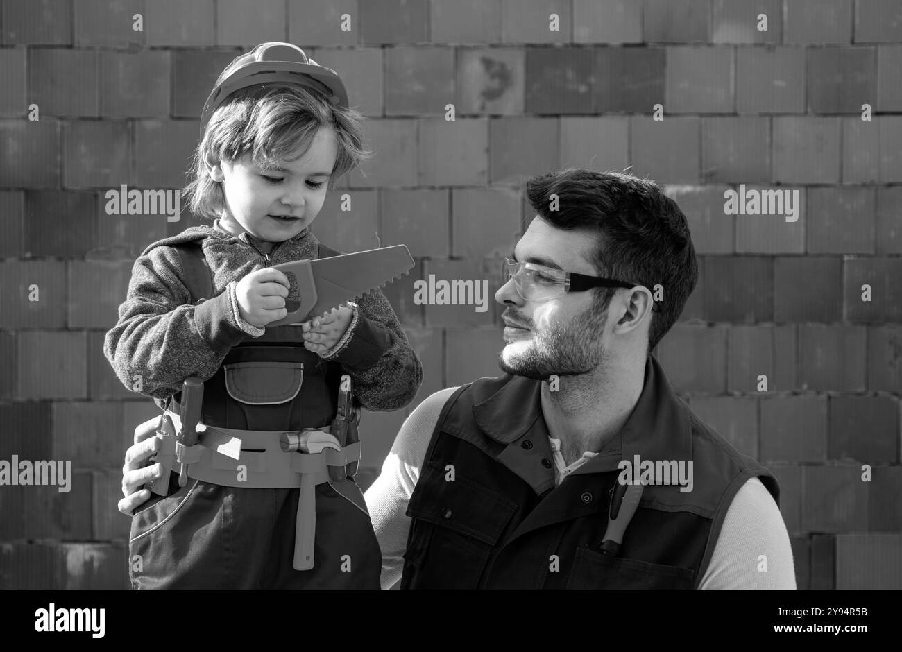 Child and brother dreaming about future career in architecture or ...
