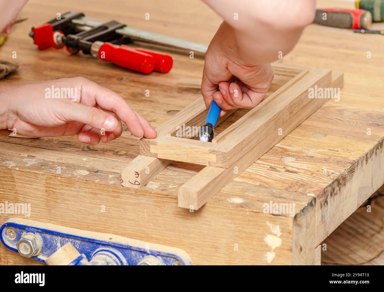Carpenter applying wood glue brush hi-res stock photography and images ...