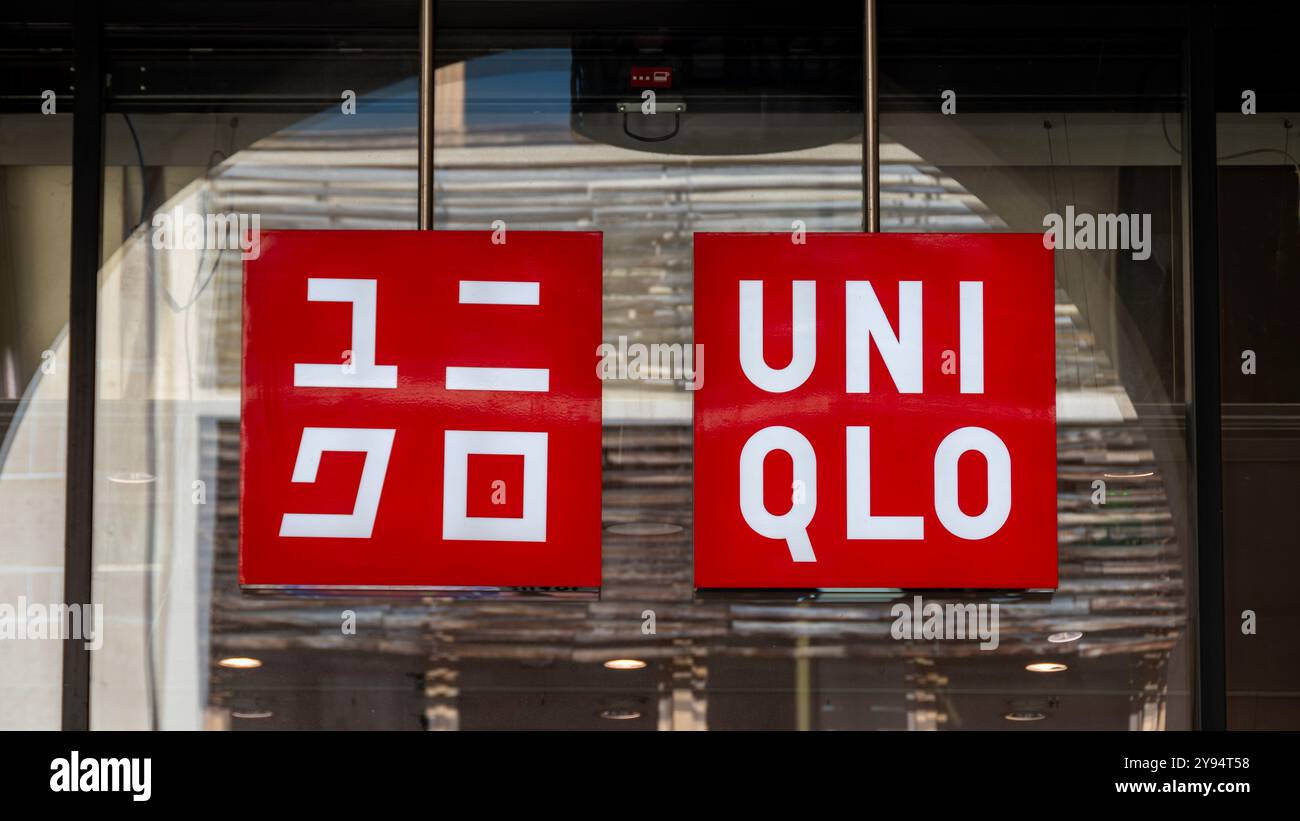 Uniqlo double sign with Japanese logo and Western logo at the entrance ...