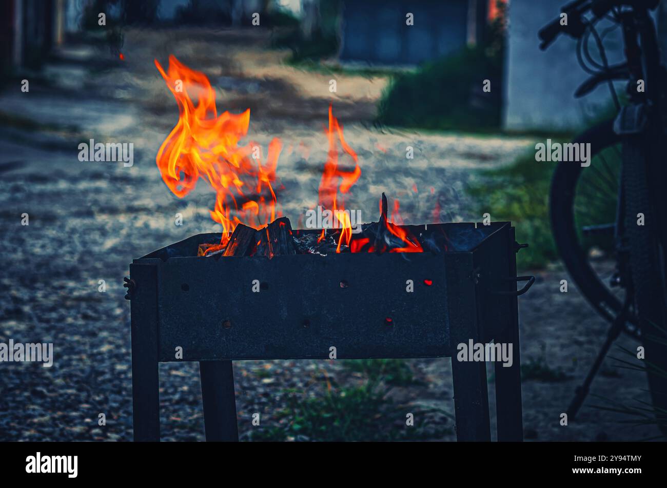 Hearth in a metal brazier. Lighting a fire for cooking barbecue Stock ...