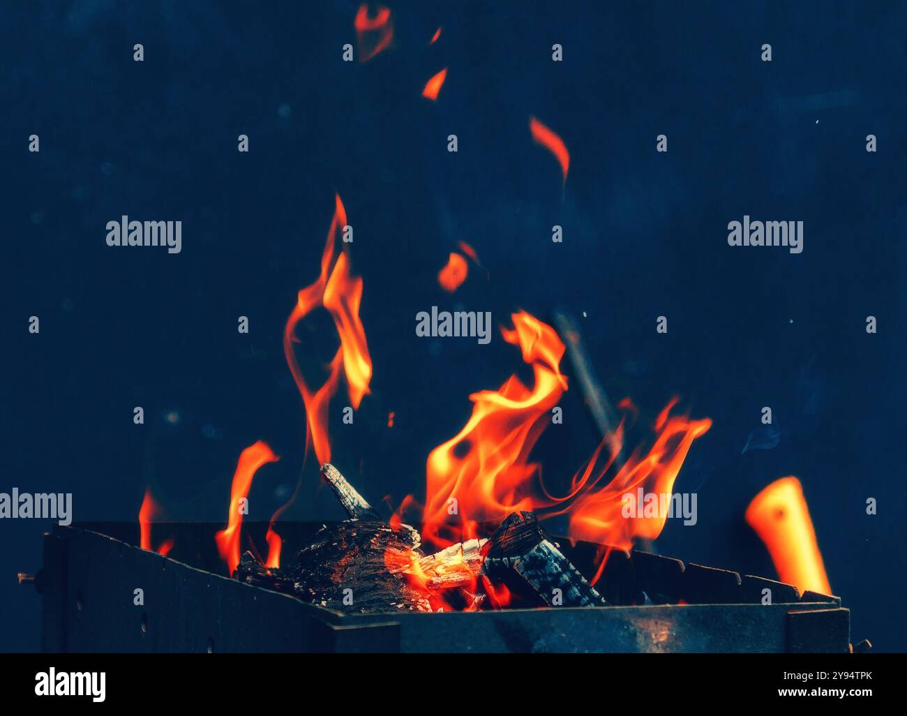 Hearth in a metal brazier. Lighting a fire for cooking barbecue Stock ...