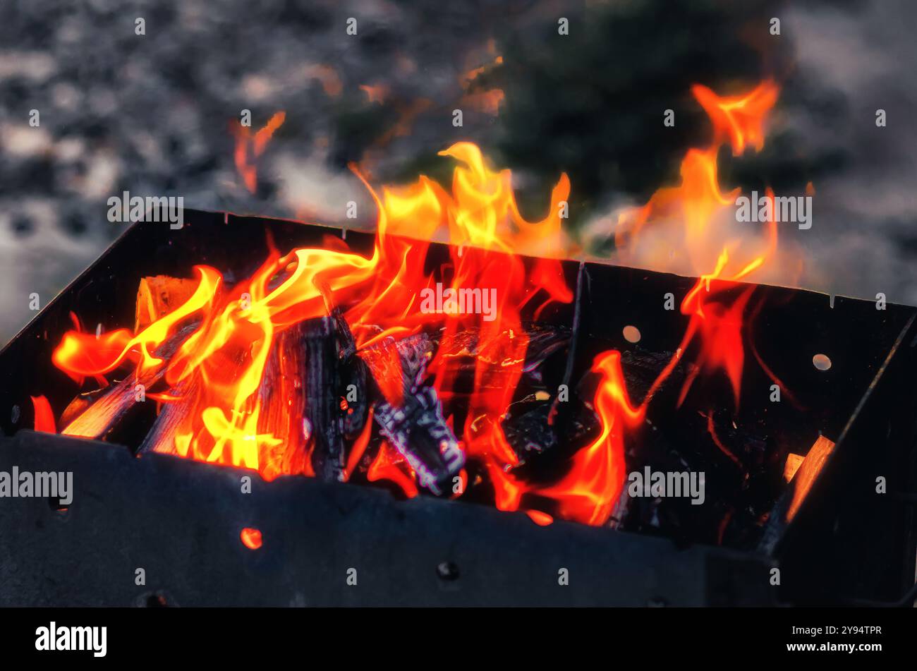 Hearth in a metal brazier. Lighting a fire for cooking barbecue Stock ...