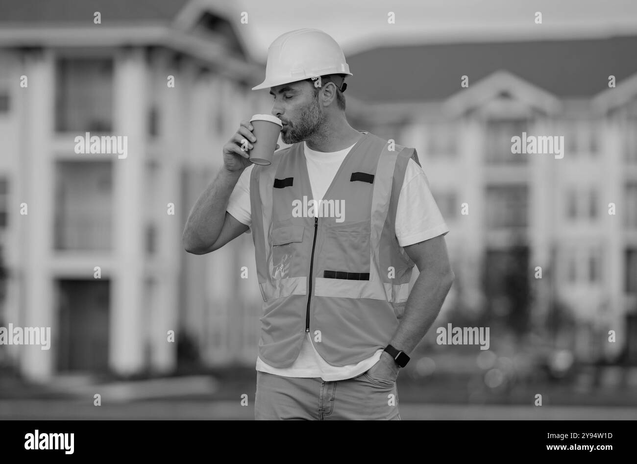 Engineer drinking take away coffee on break. Engineer drinking take ...