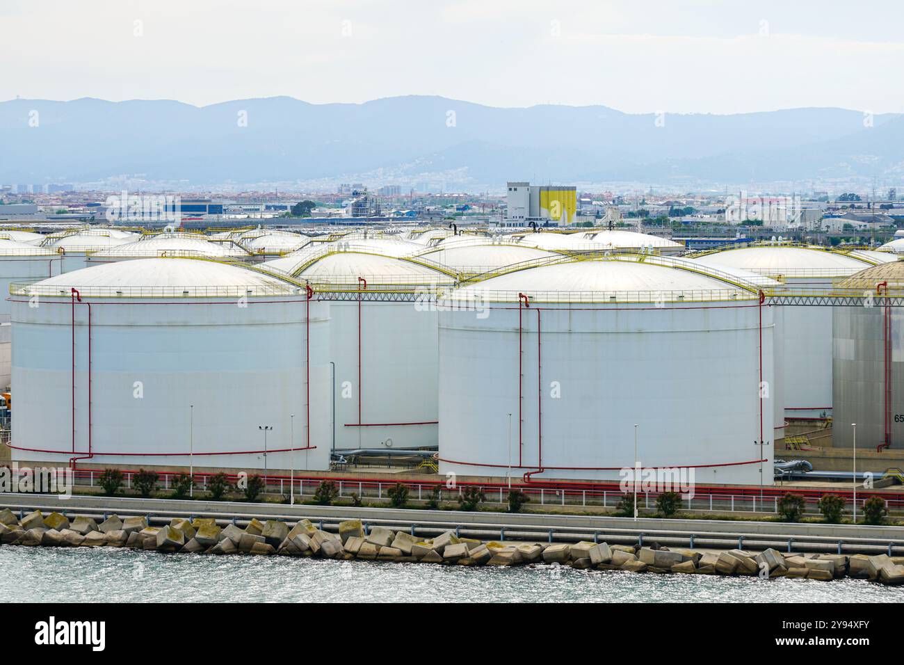 White tanks in tank farm, big silos, tall metal tanks, multiple steel ...