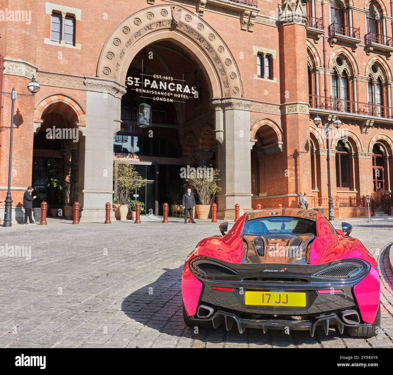 A McLaren sports car parked outside the St Pancras Renaissance hotel ...