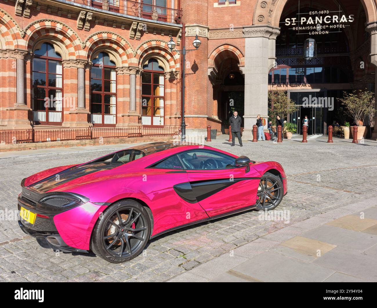 A McLaren sports car parked outside the St Pancras Renaissance hotel ...