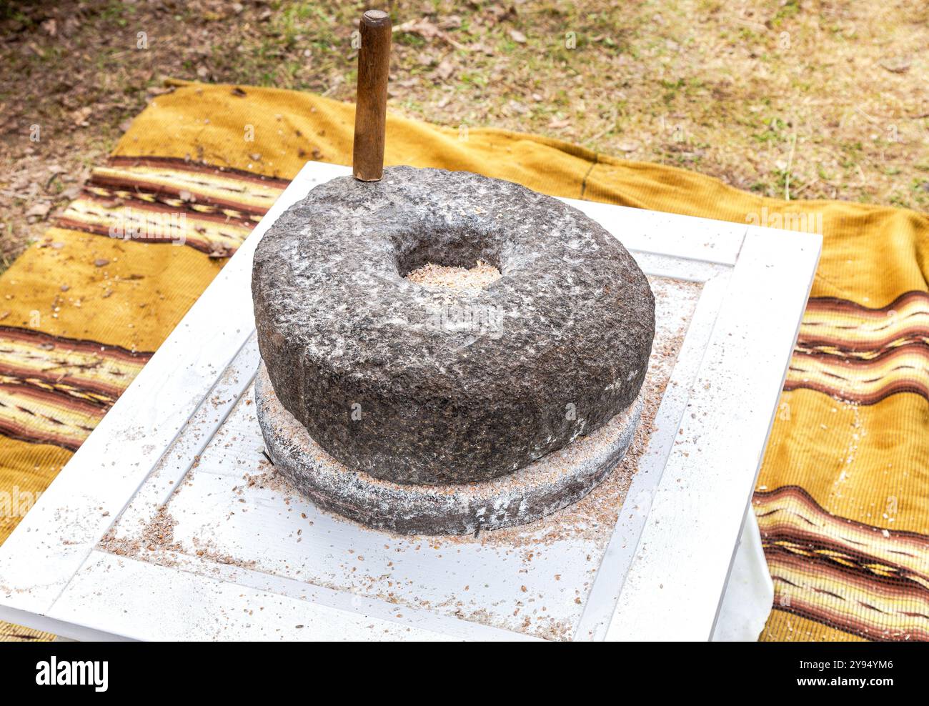 Ancient stone rotary mill for hand-grinding a grain into flour. Old ...