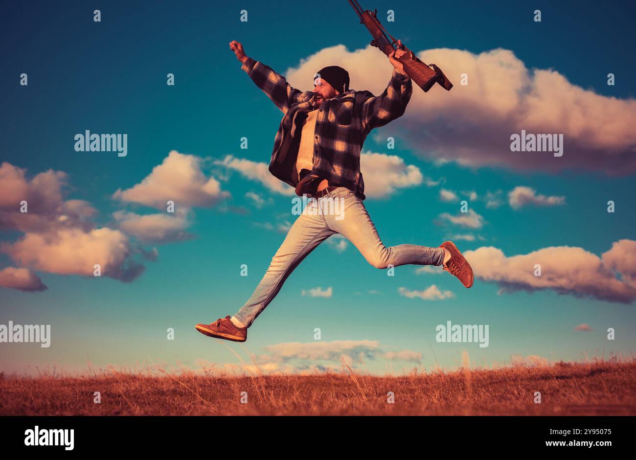 Happy hunter. Hunter with shotgun gun on hunt Stock Photo - Alamy