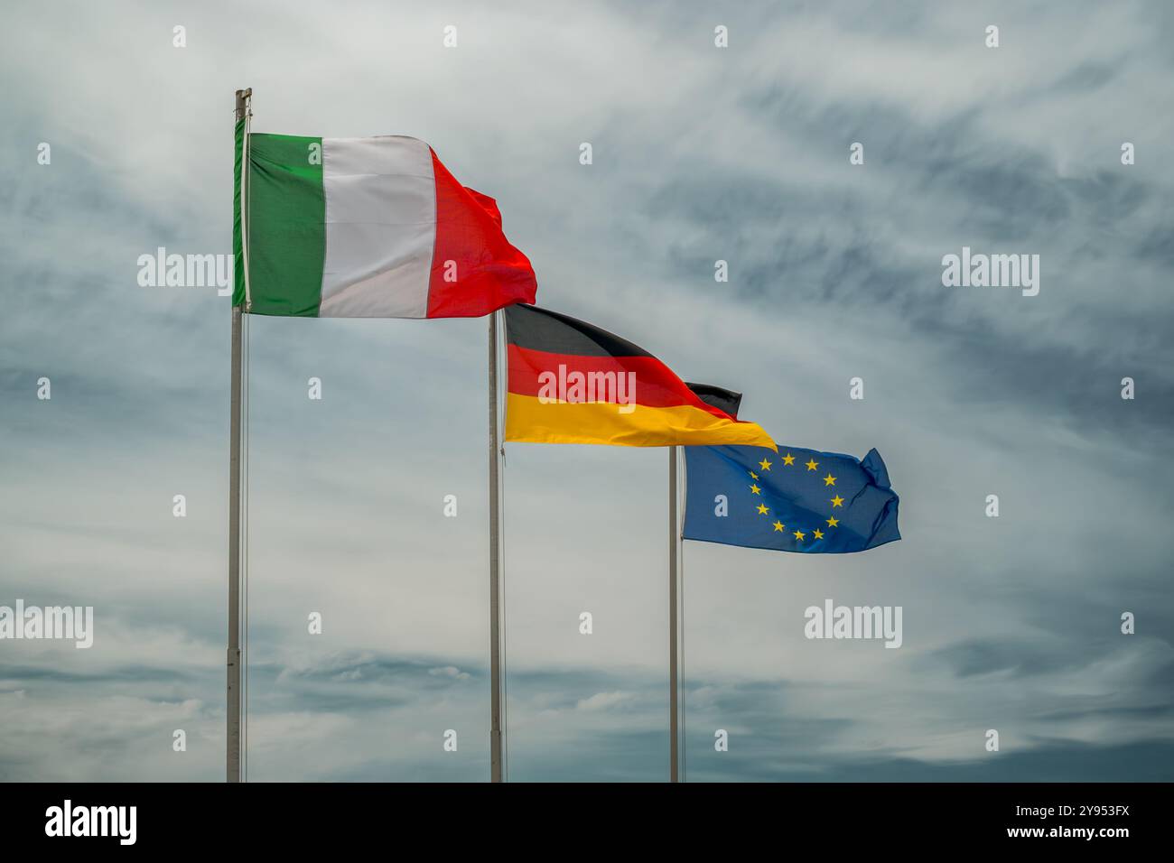 The Italian and German flags next to the European Union flag to ...