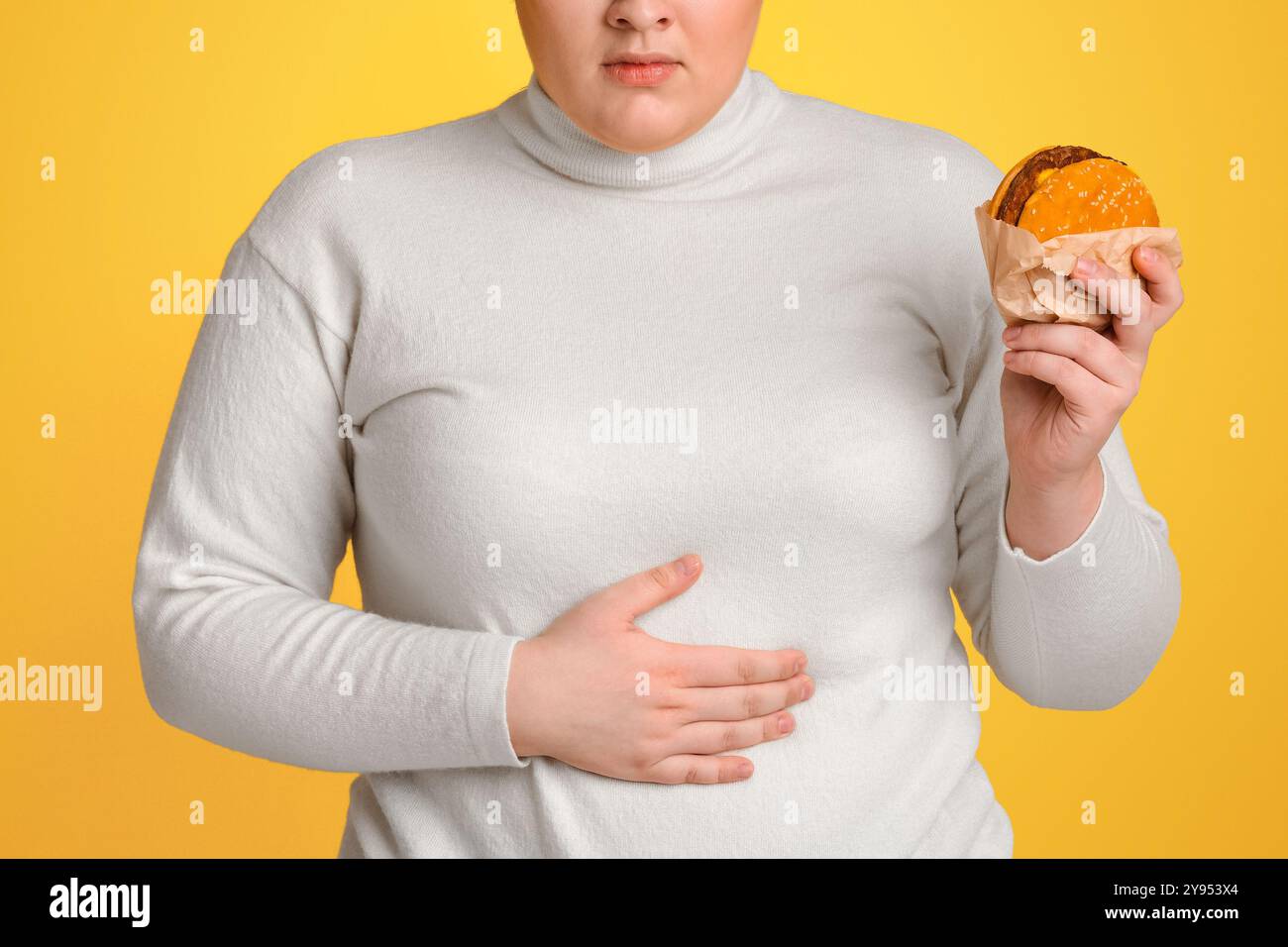 Stomachache. Girl Holding Burger And Touching Stomach Feeling Bad After ...
