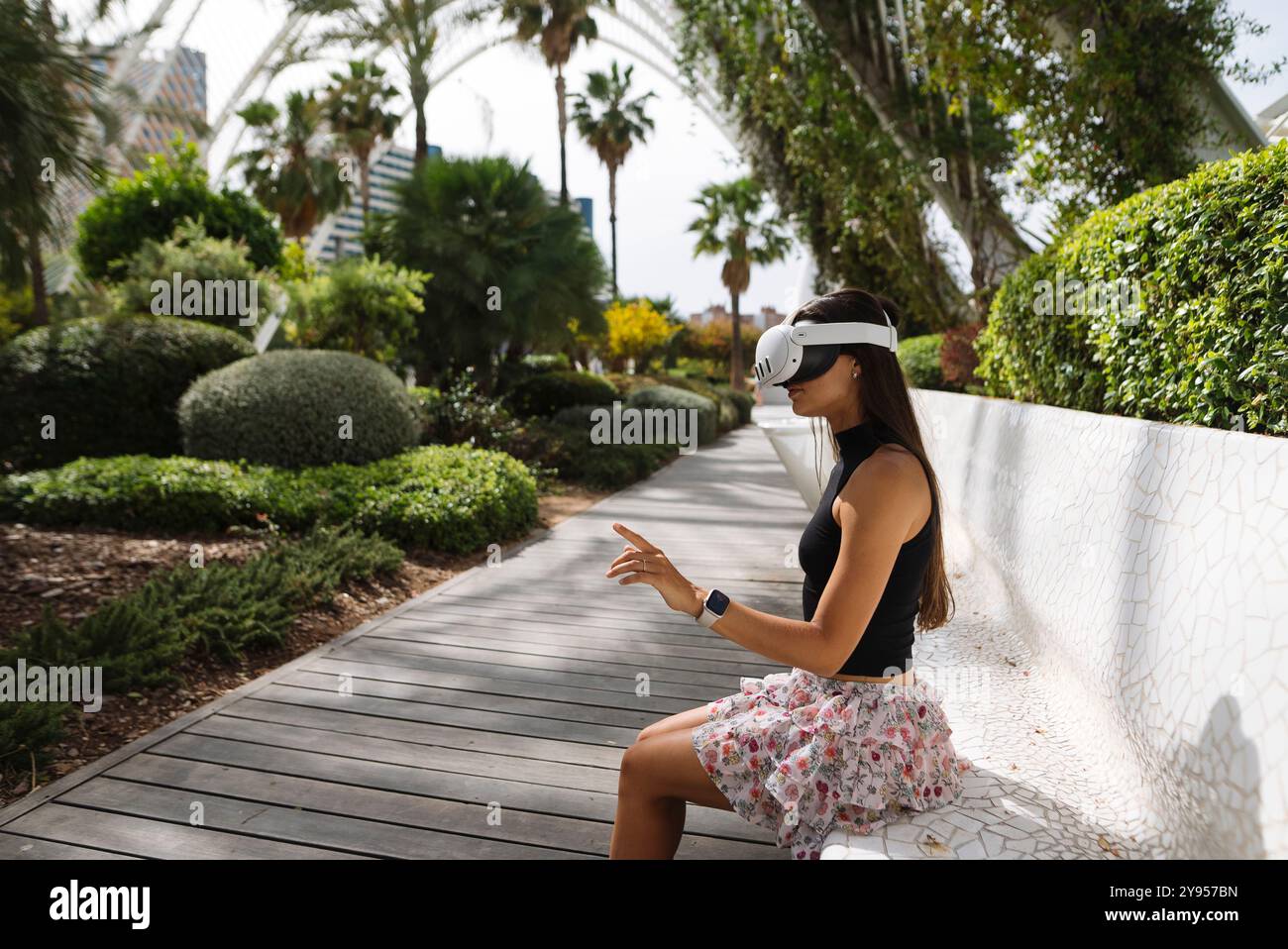 A Woman Delightfully Engaging in Virtual Reality While Surrounded by a ...